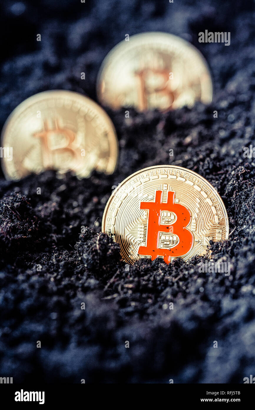 bitcoin in earth - cryptocurrency mining concept Stock Photo - Alamy