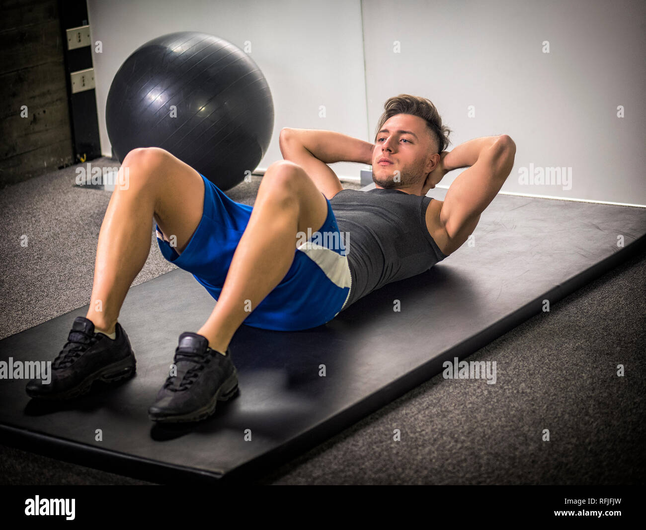 Doing abs exercises hi-res stock photography and images - Alamy
