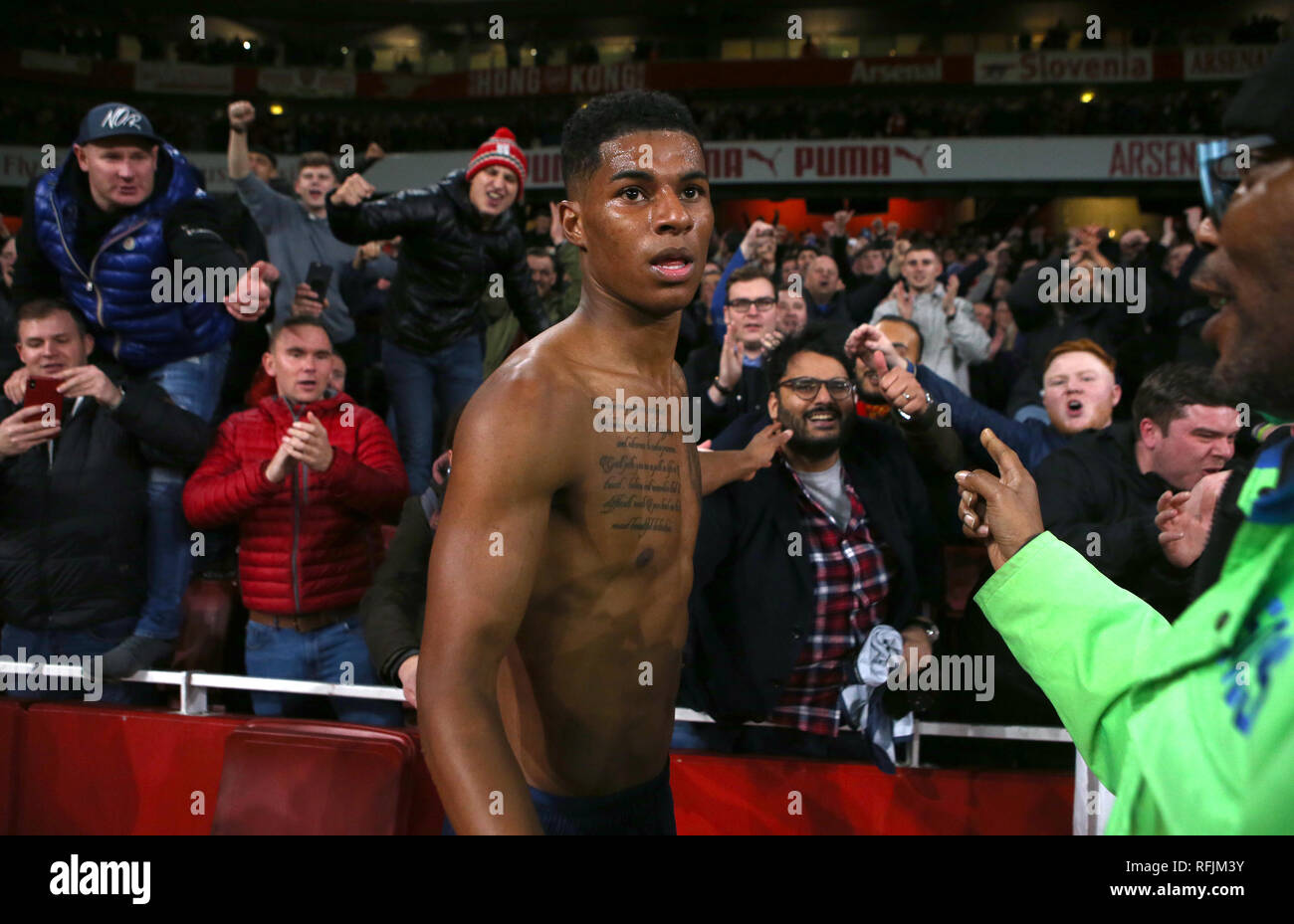 Manchester United's Marcus Rashford gives his shirt to a fan after the ...