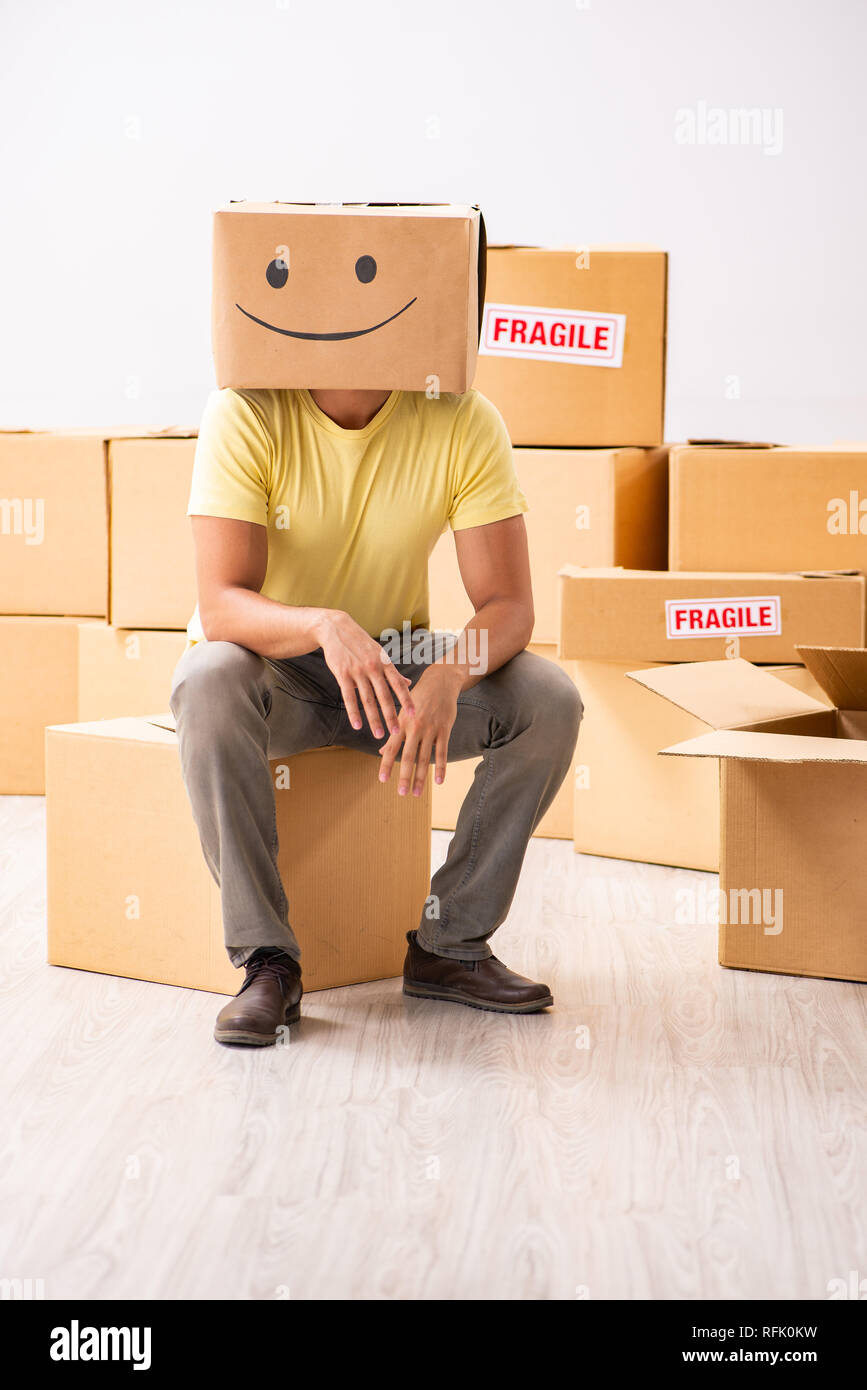 Happy man with box instead of his head Stock Photo - Alamy