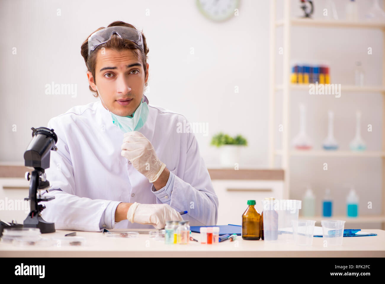 Male entomologist working in the lab on new species Stock Photo - Alamy