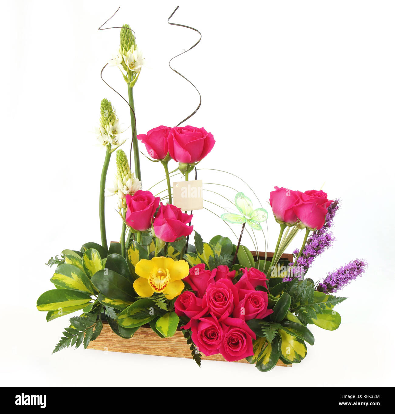 Floral gift arrangement made with red roses with long stems and yellow ...