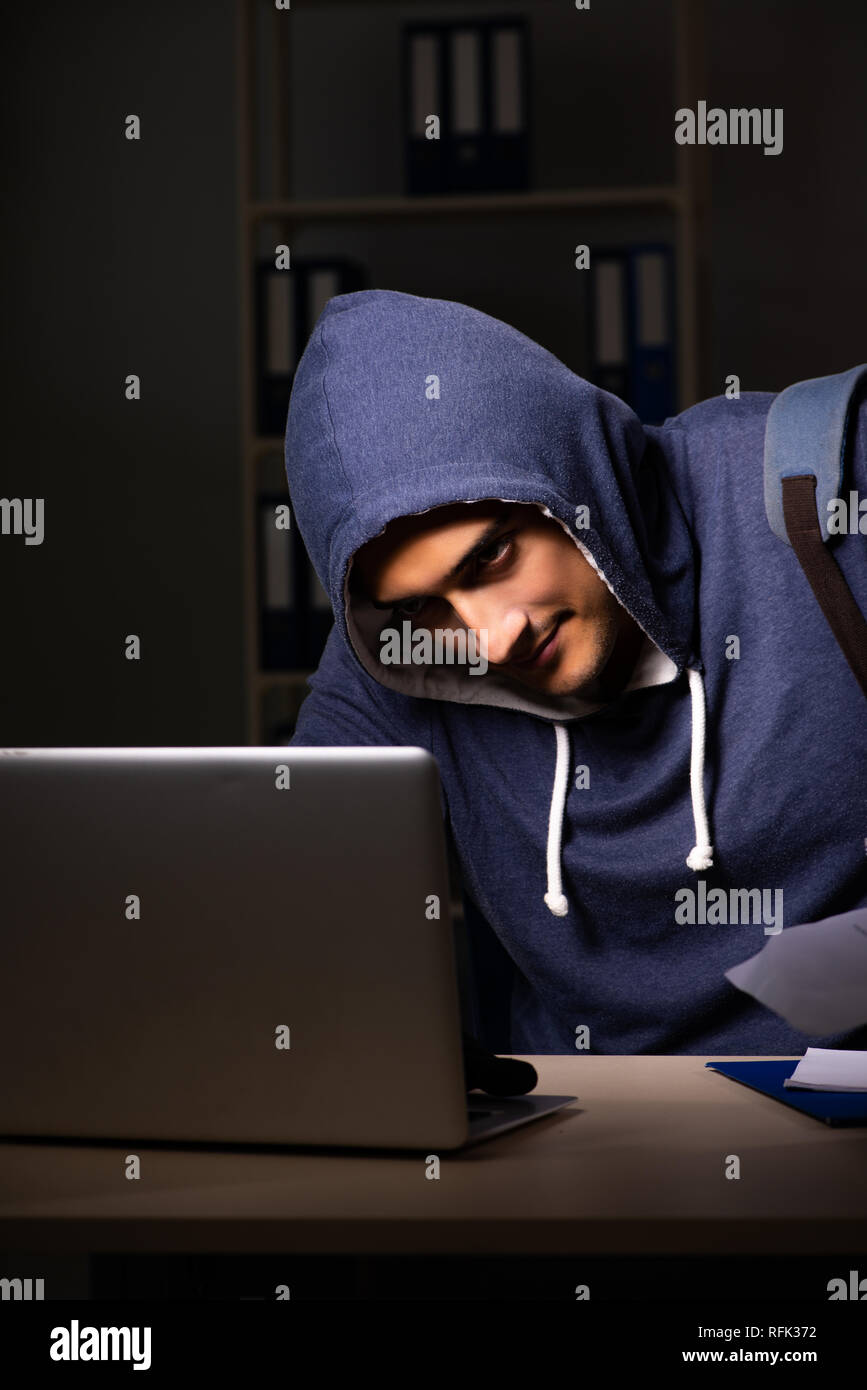 Thief trying to steal personal data in identity theft concept Stock ...