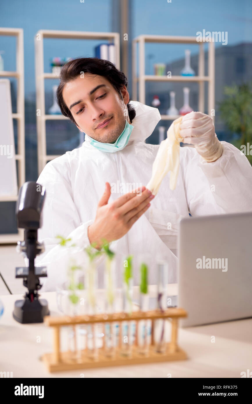 Male biotechnology scientist chemist working in the lab Stock Photo - Alamy