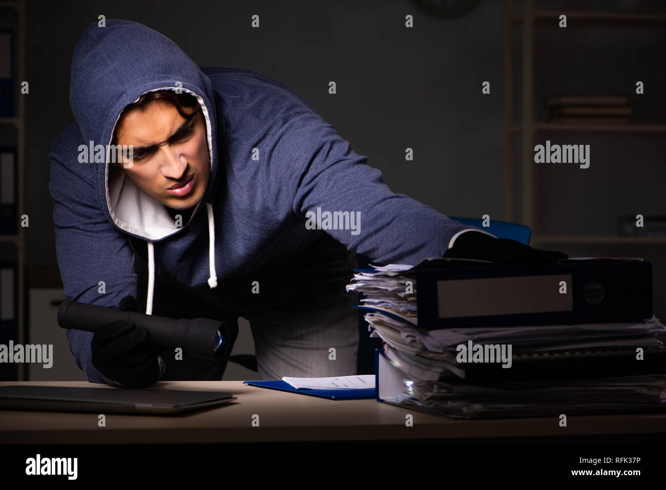 Thief trying to steal personal data in identity theft concept Stock ...