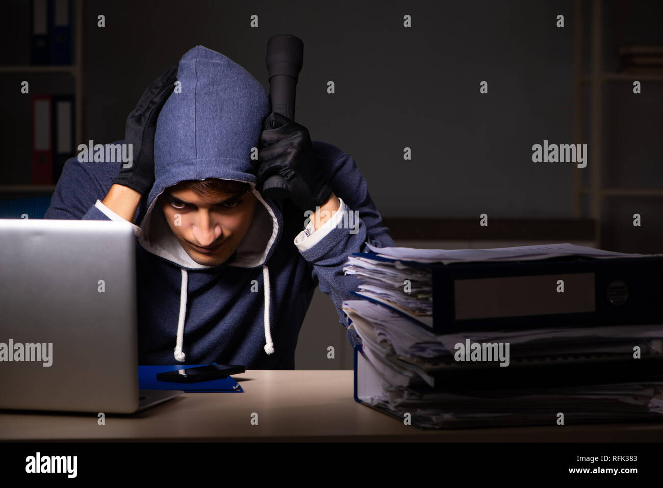 Thief trying to steal personal data in identity theft concept Stock ...