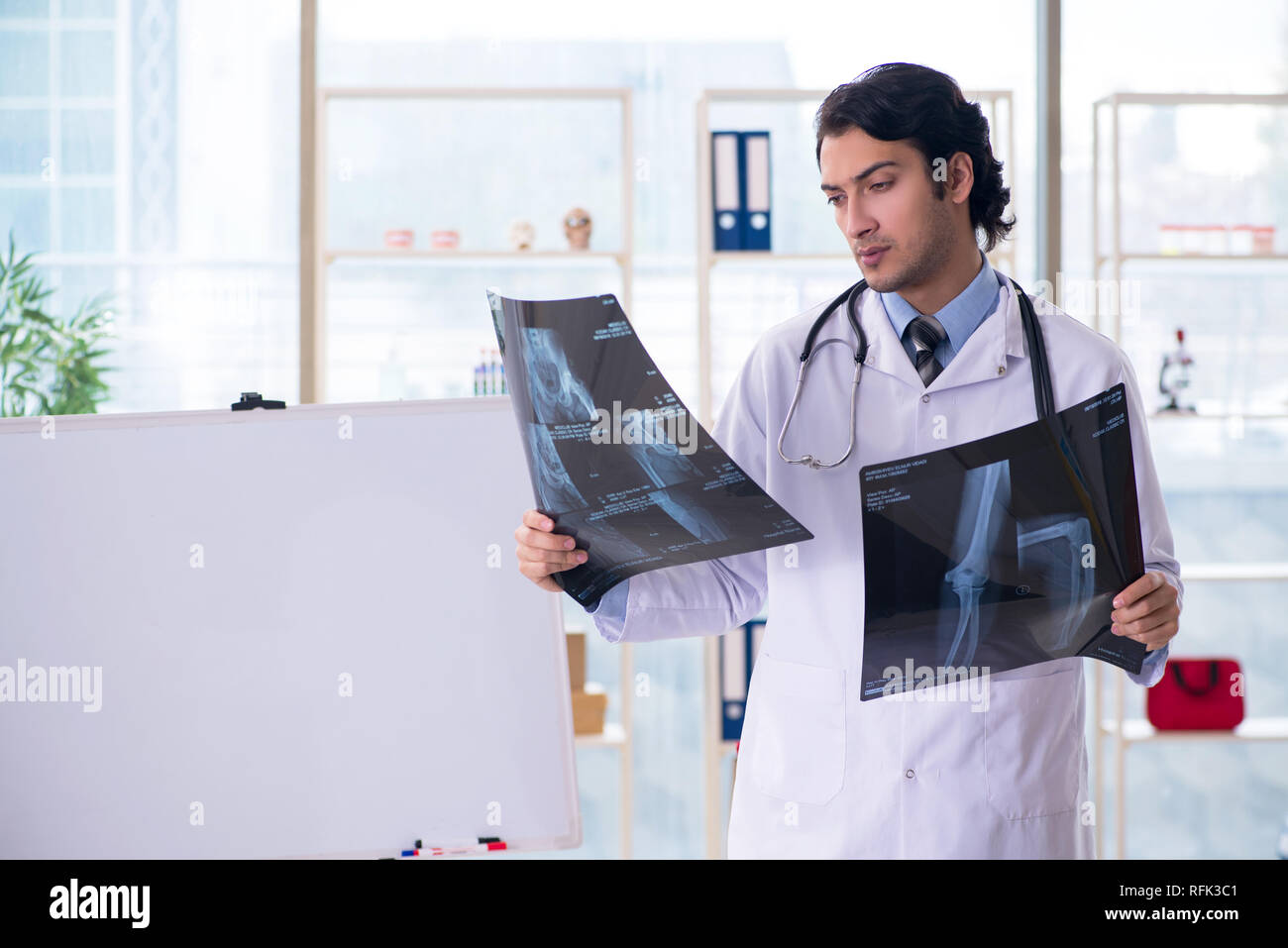 Young handsome male radiologist in front of whiteboard Stock Photo - Alamy