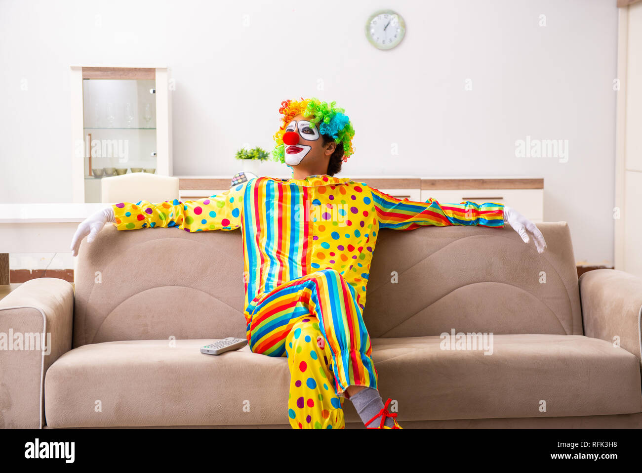Male clown preparing for perfomance at home Stock Photo - Alamy