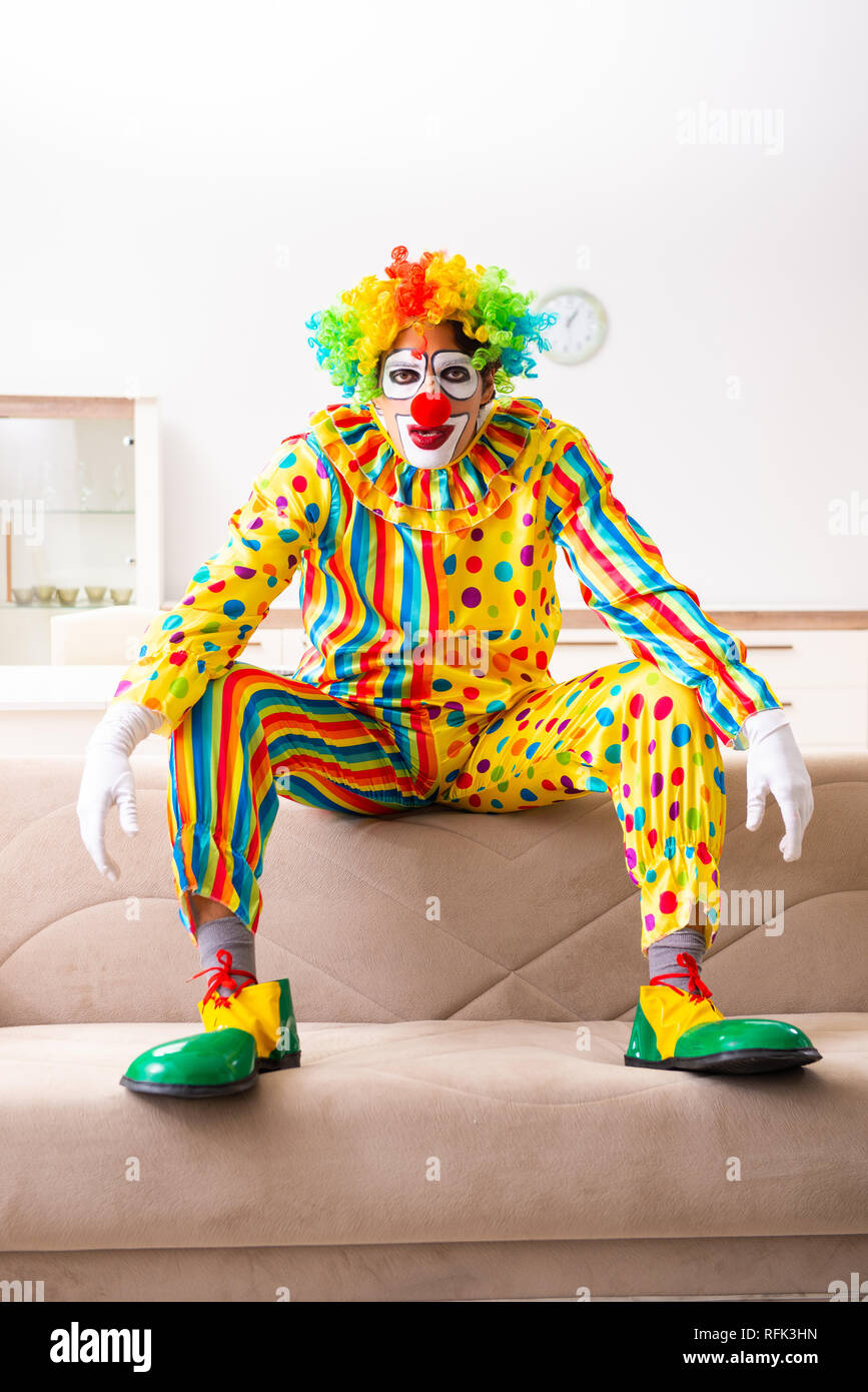 Male clown preparing for perfomance at home Stock Photo - Alamy