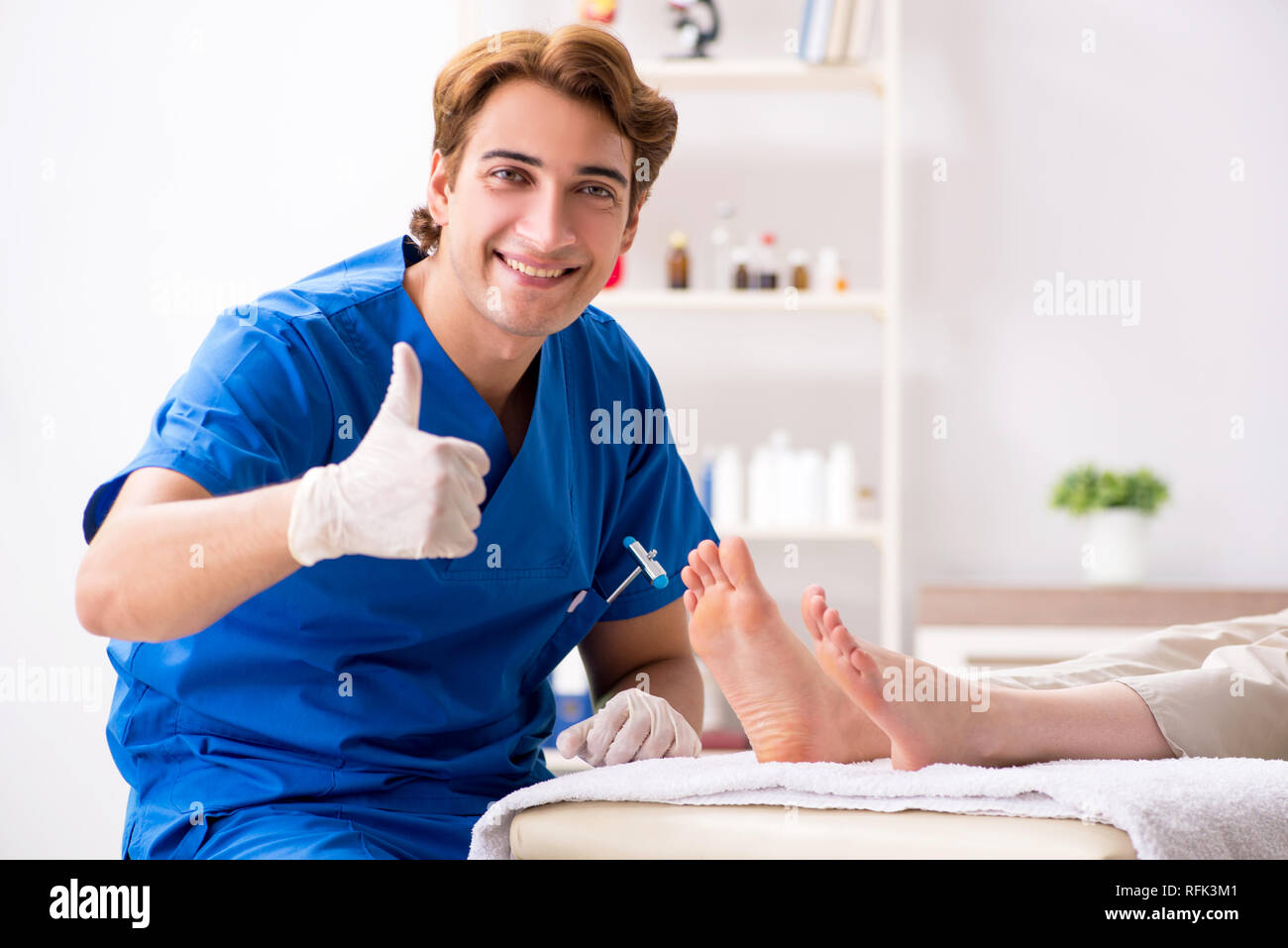Podiatrist treating feet during procedure Stock Photo - Alamy