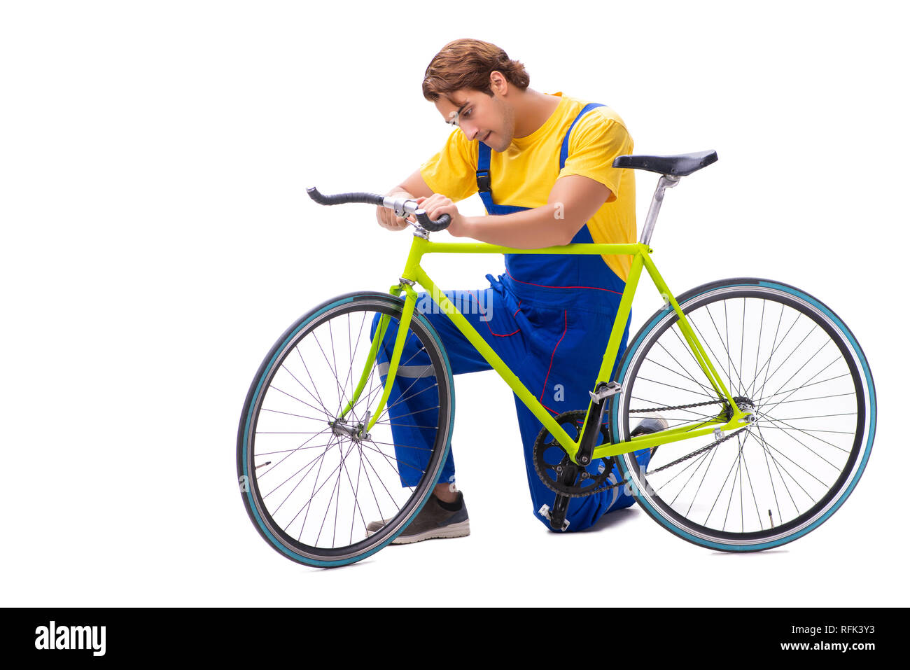 Man repairing his bike isolated on white background Stock Photo - Alamy