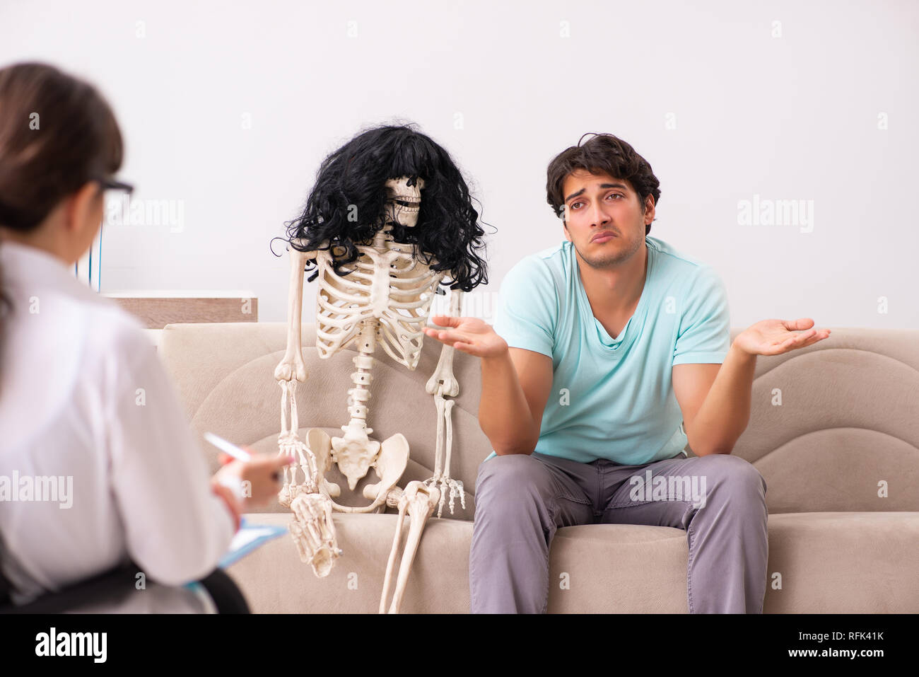 Young patient visiting psychologist for therapy Stock Photo - Alamy