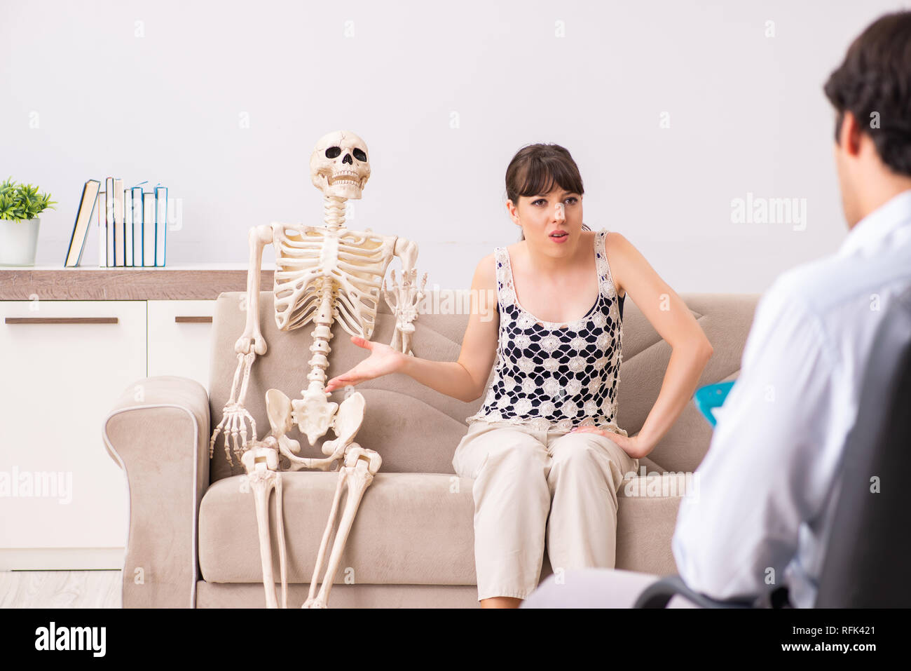 Young patient visiting psychologist for therapy Stock Photo - Alamy