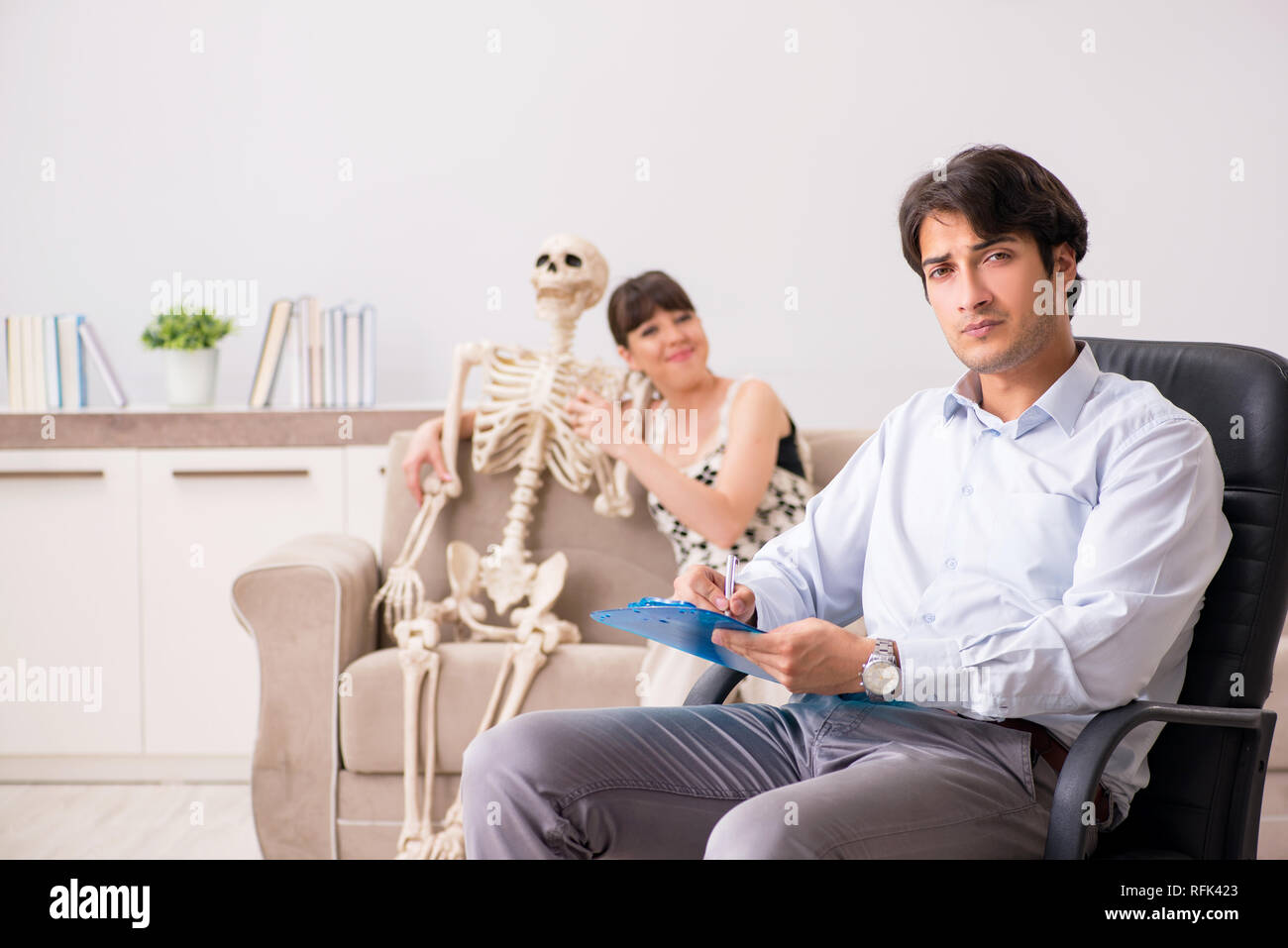 Young patient visiting psychologist for therapy Stock Photo - Alamy