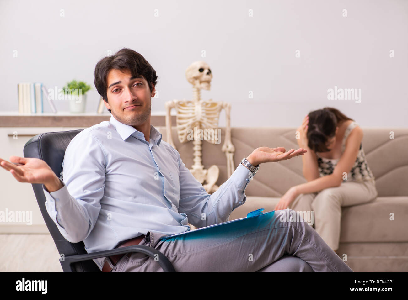 Young patient visiting psychologist for therapy Stock Photo - Alamy
