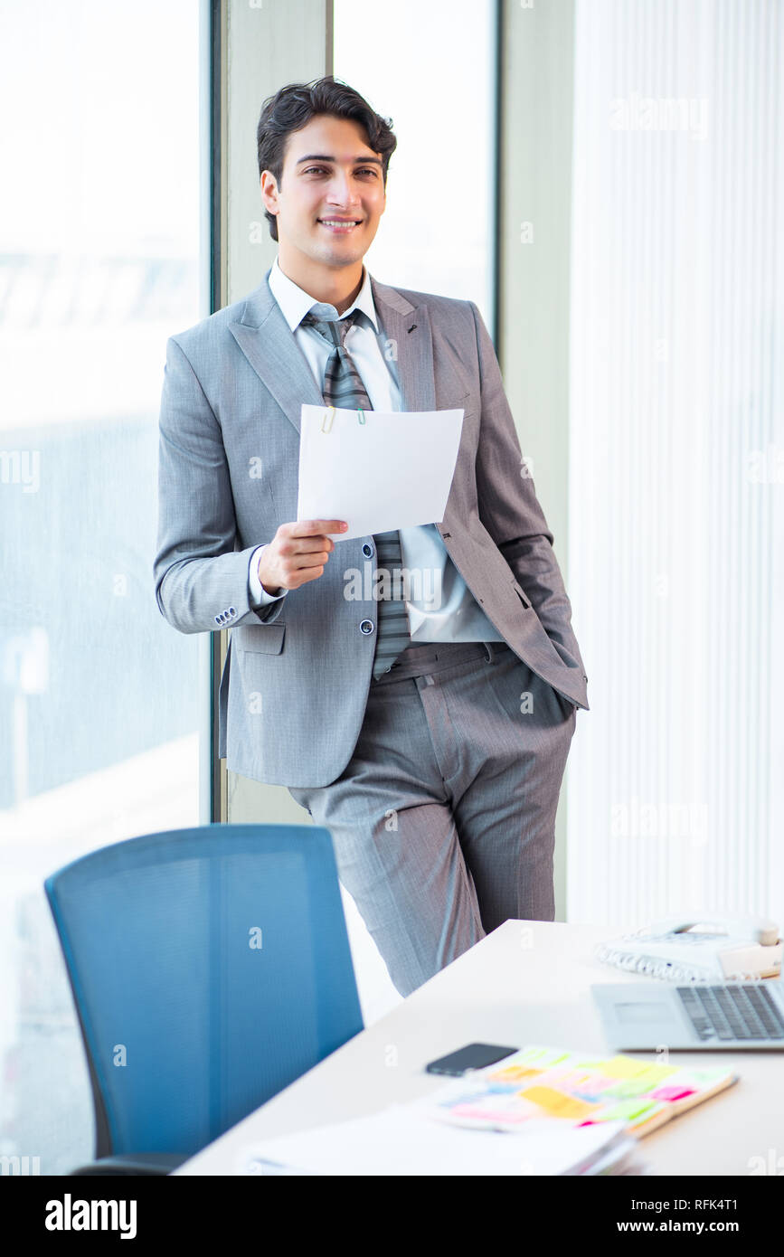 Young successful businessman working at the office Stock Photo - Alamy