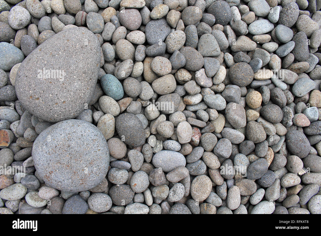 Big stones among smaller pebbles, in the garden. Meditative Stock Photo ...