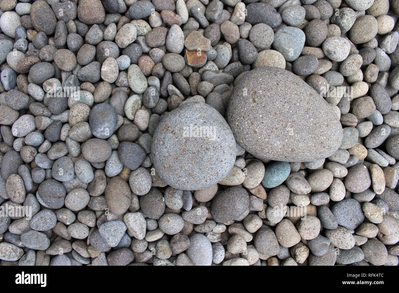 Big stones among smaller pebbles, in the garden. Meditative Stock Photo ...