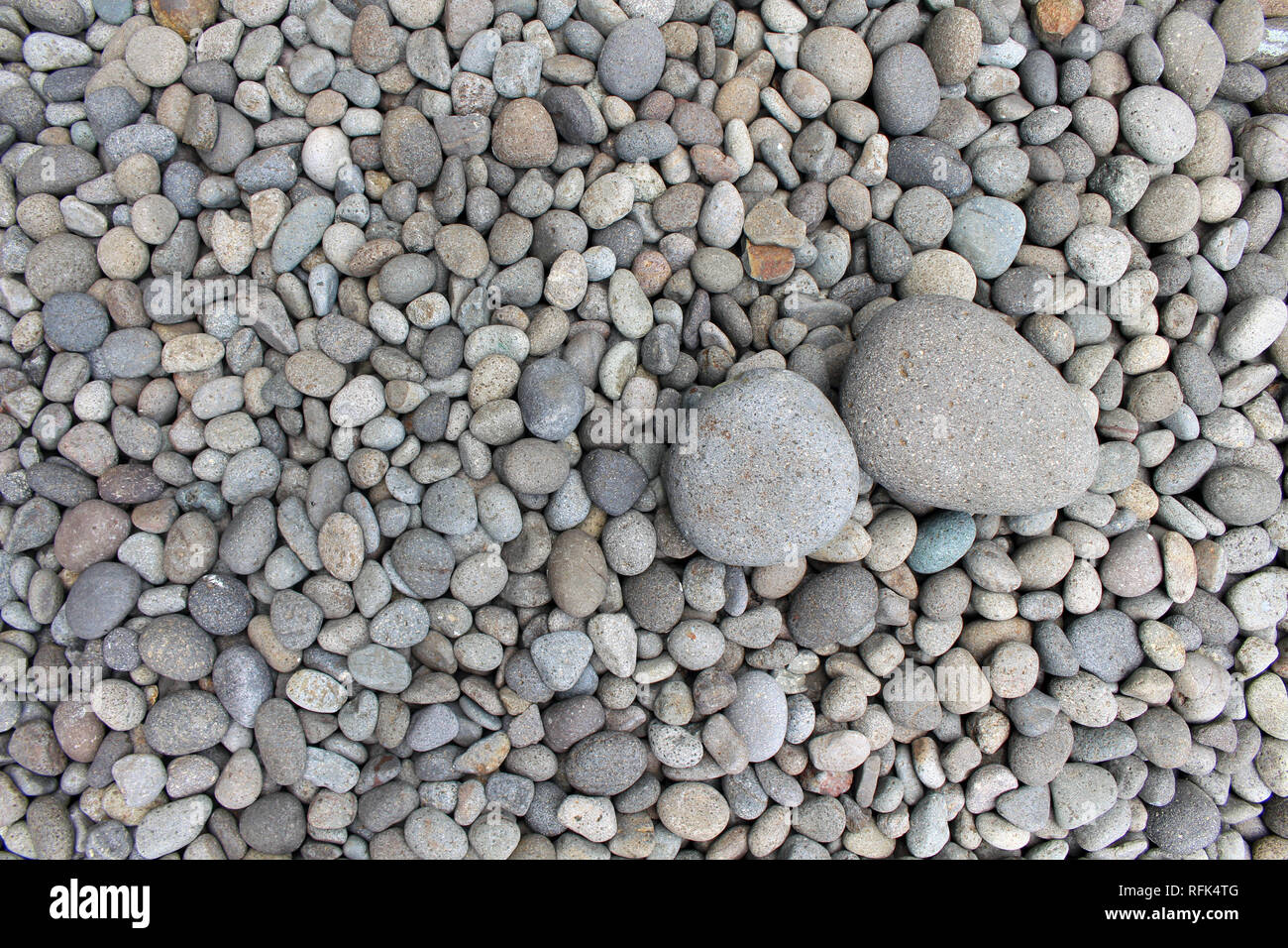 Big stones among smaller pebbles, in the garden. Meditative Stock Photo ...