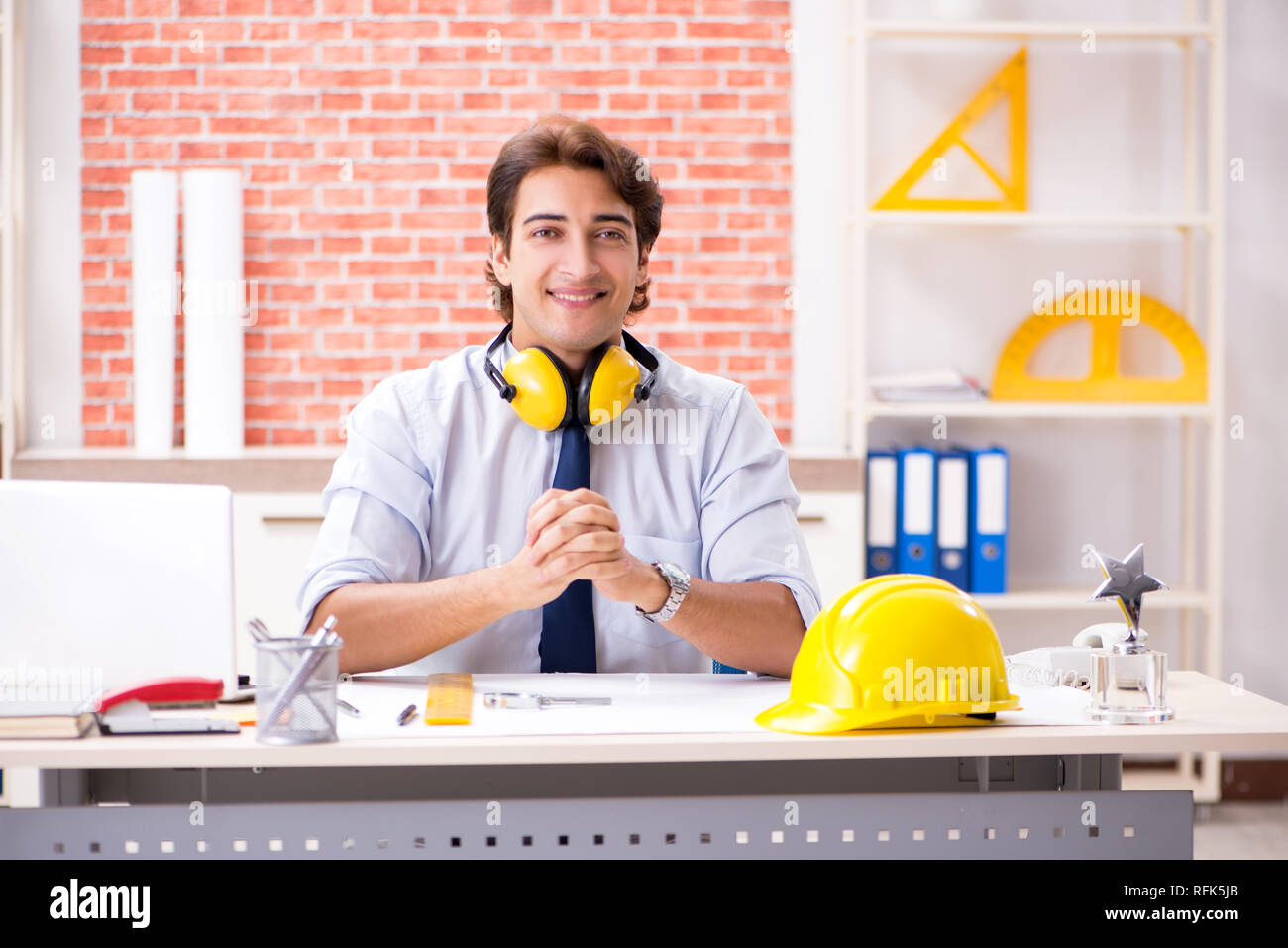 Construction supervisor working on blueprints Stock Photo - Alamy