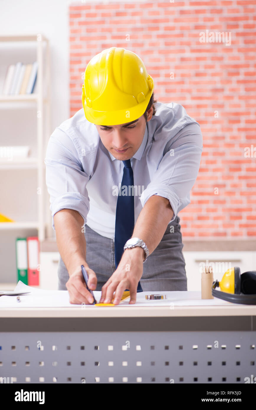 Construction supervisor working on blueprints Stock Photo - Alamy