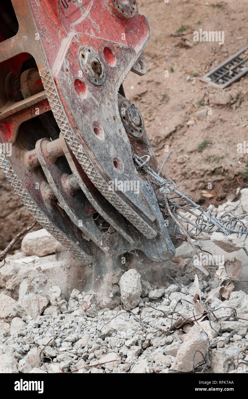 Close-up of Concrete Cracker grinding reinforced concrete from the ...