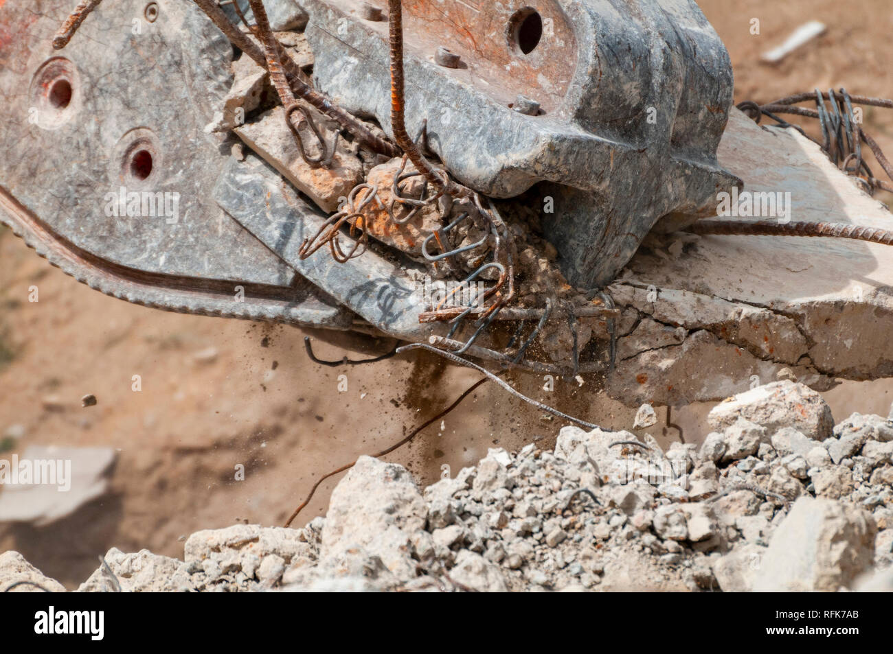 Close-up of Concrete Cracker grinding reinforced concrete from the ...