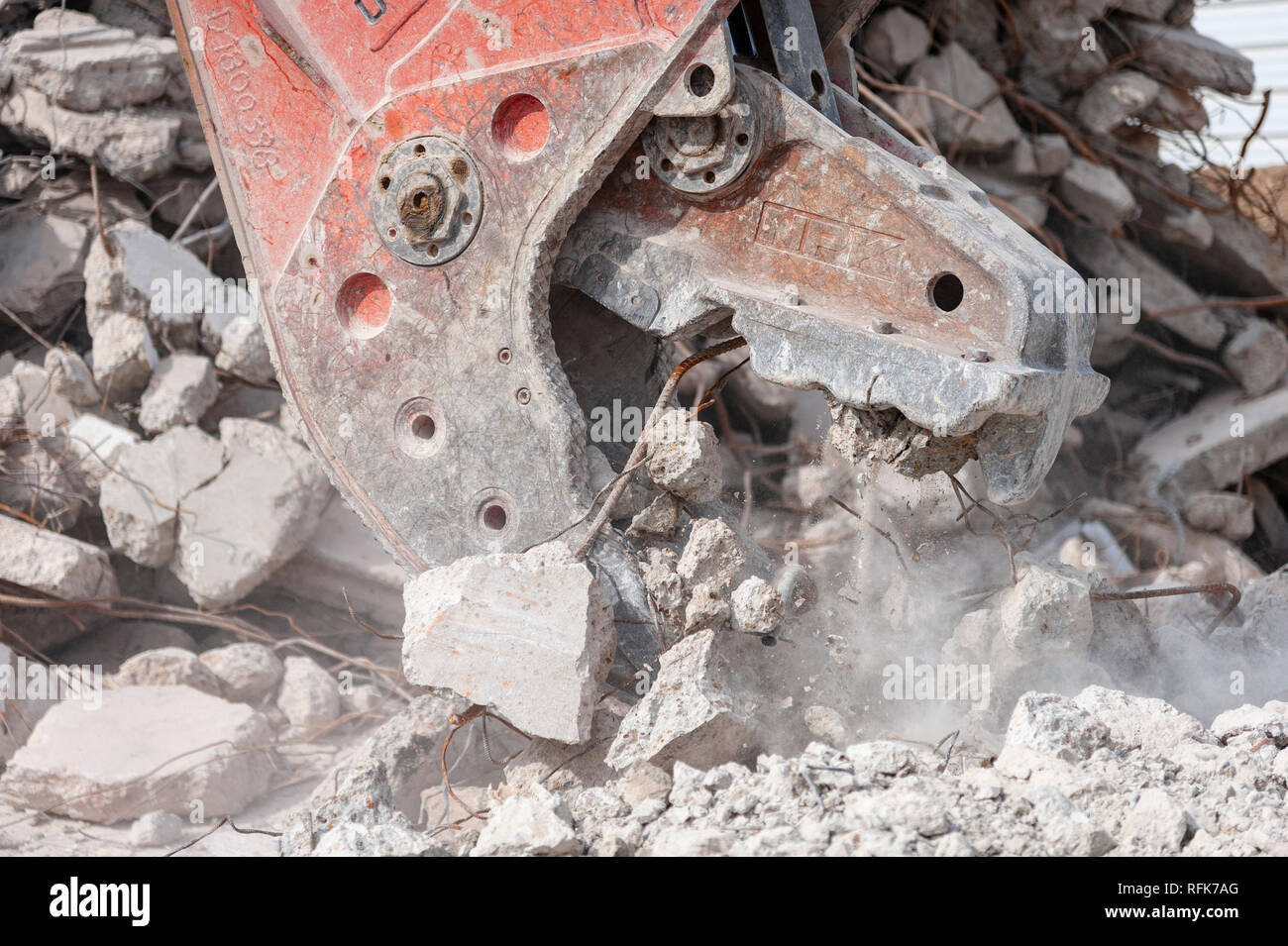 Close-up of Concrete Cracker grinding reinforced concrete from the ...