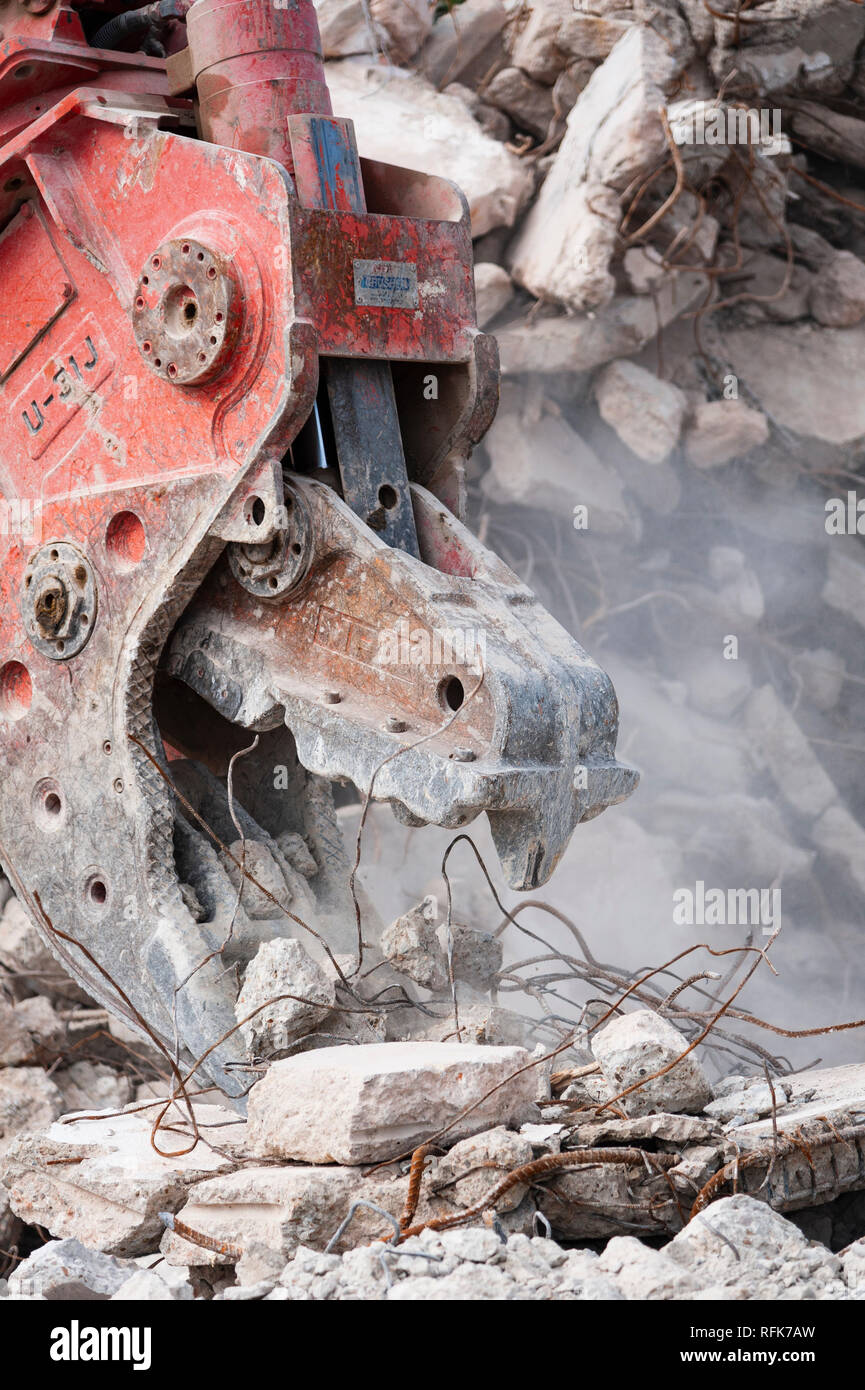 Close-up of Concrete Cracker grinding reinforced concrete from the ...