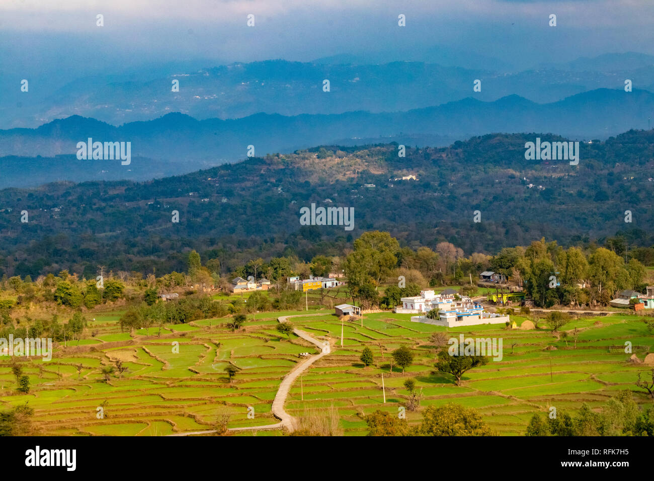 Farm on top of a green hill and countryside houses view from top ...