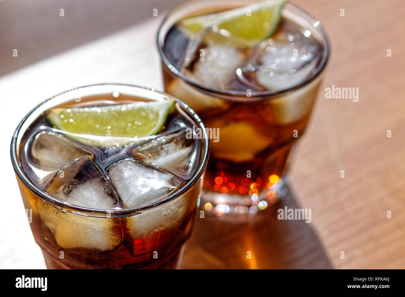 Rum. Cola Cuba Libre with Lime and Ice. Top view Stock Photo - Alamy