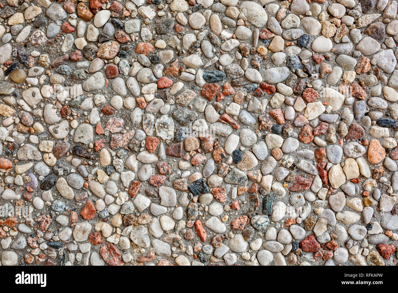 wall of small stones pebbles texture background Stock Photo - Alamy