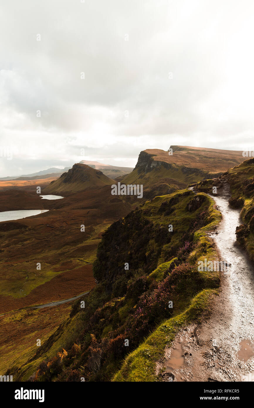 Hiking path at Quiraing on a moody cloudy autumn day with orange ...