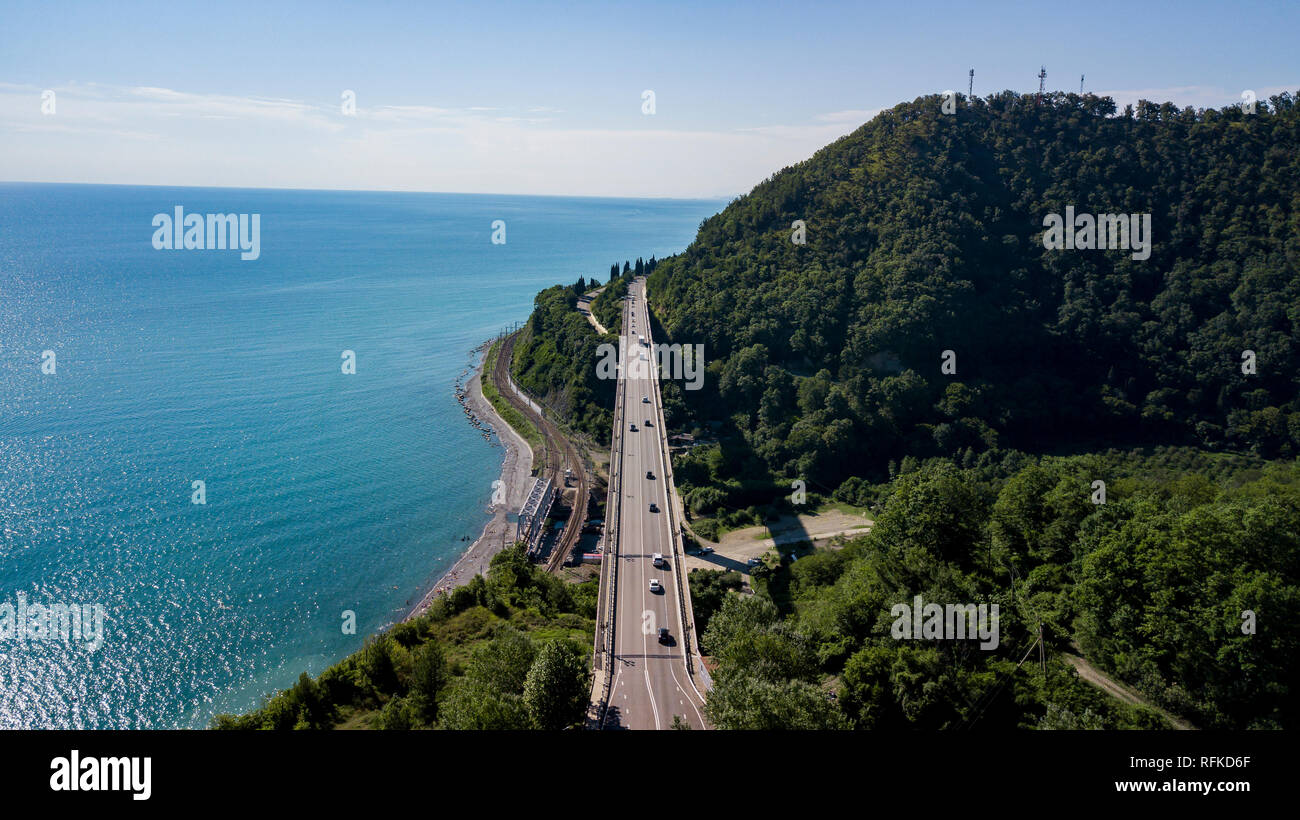 People traveling, road trip on curvy road through beautiful countryside ...