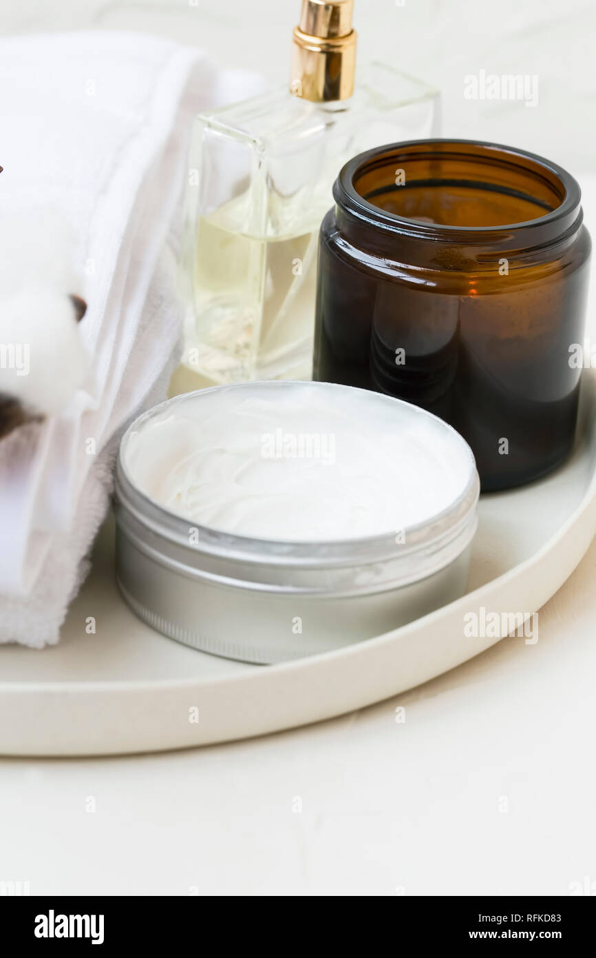 Spa still life with lotion , candle and perfume bottle, minimalist ...