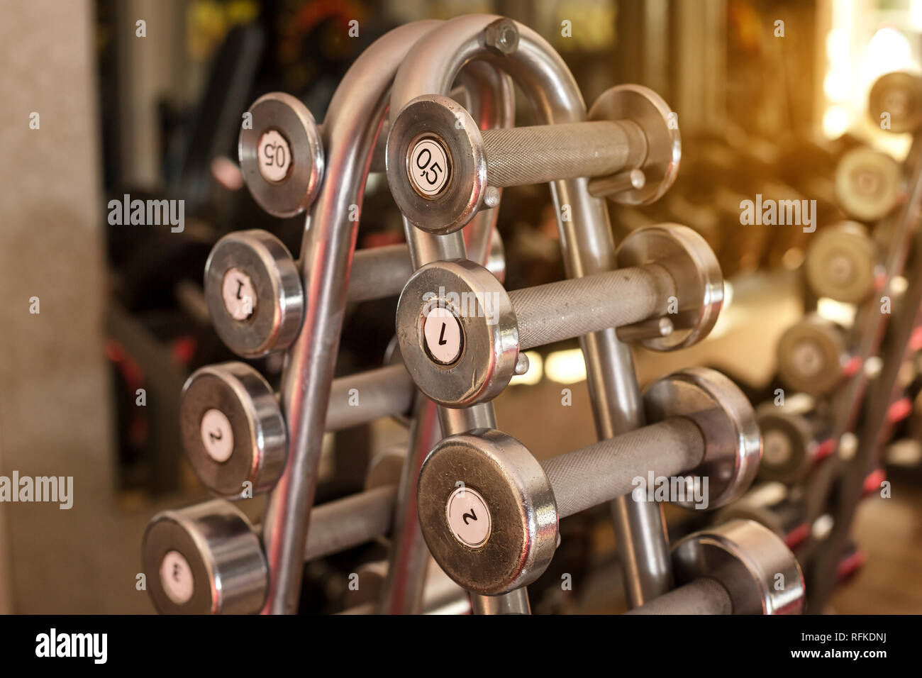 weights are in a row in the gym Stock Photo - Alamy