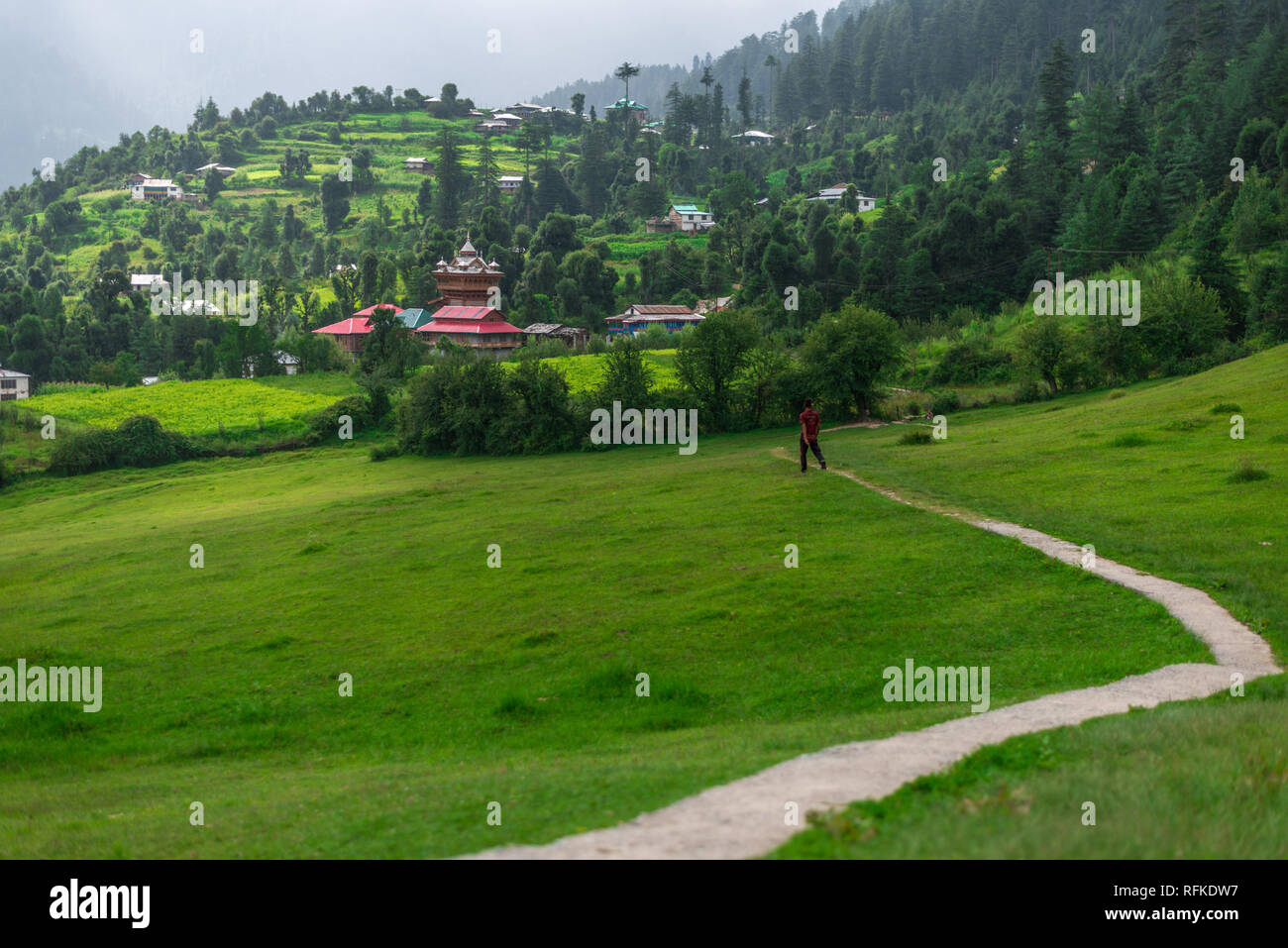 Photo of Temple in Green meadows in himalayas, Great Himalayan National ...