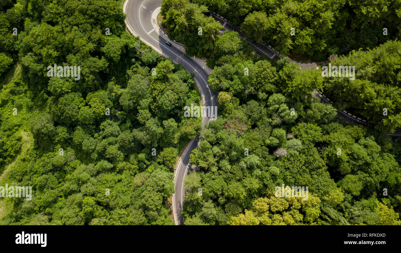 Directly above view of cars on a curvy road Stock Photo - Alamy
