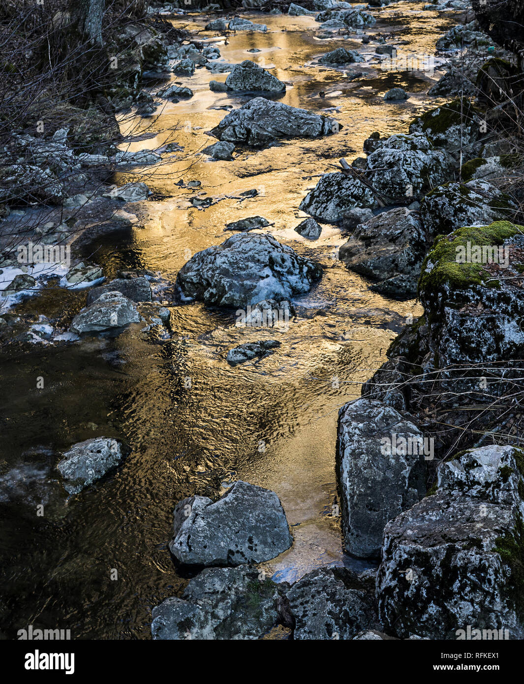 Water stream, with bright colour reflex Stock Photo - Alamy