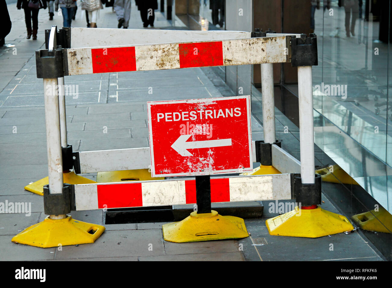 Pedestrian sign with arrow mark open coal hole Stock Photo - Alamy