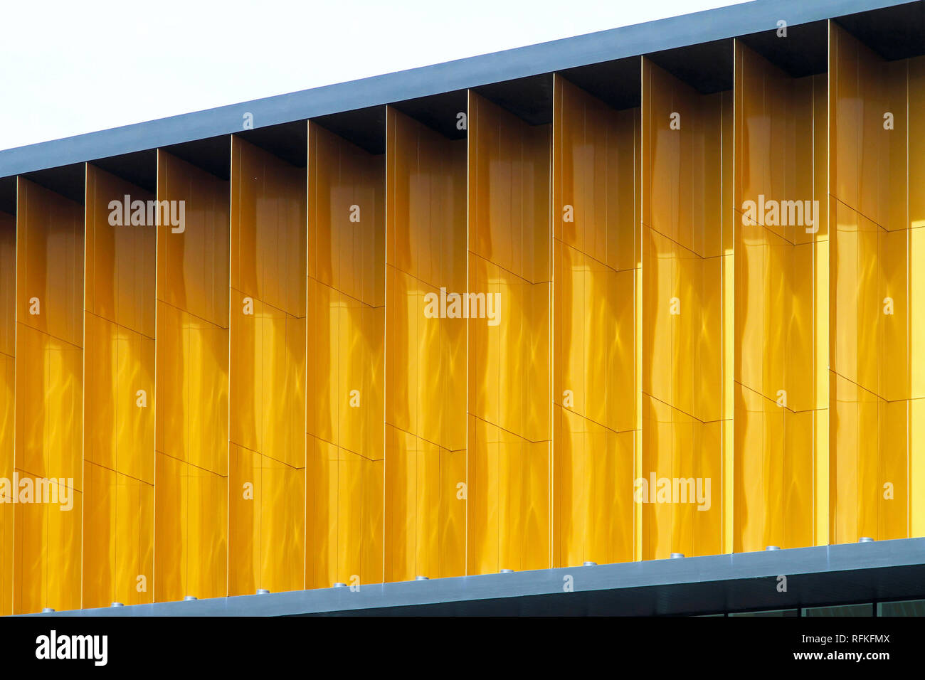 Golden windows at modern building with sharp lines Stock Photo - Alamy