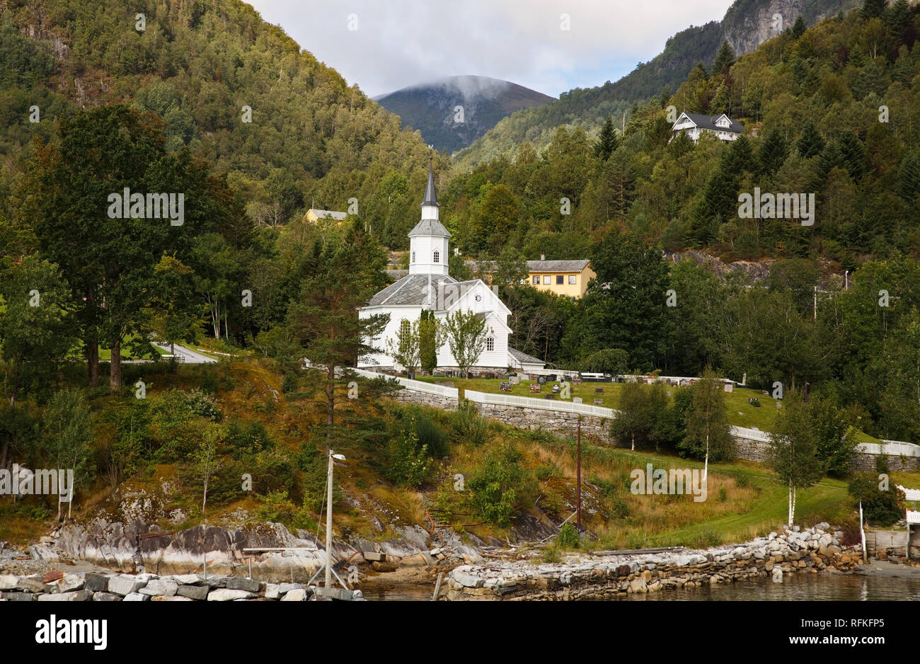 Landscape with mountains, church and village in Norway Stock Photo - Alamy