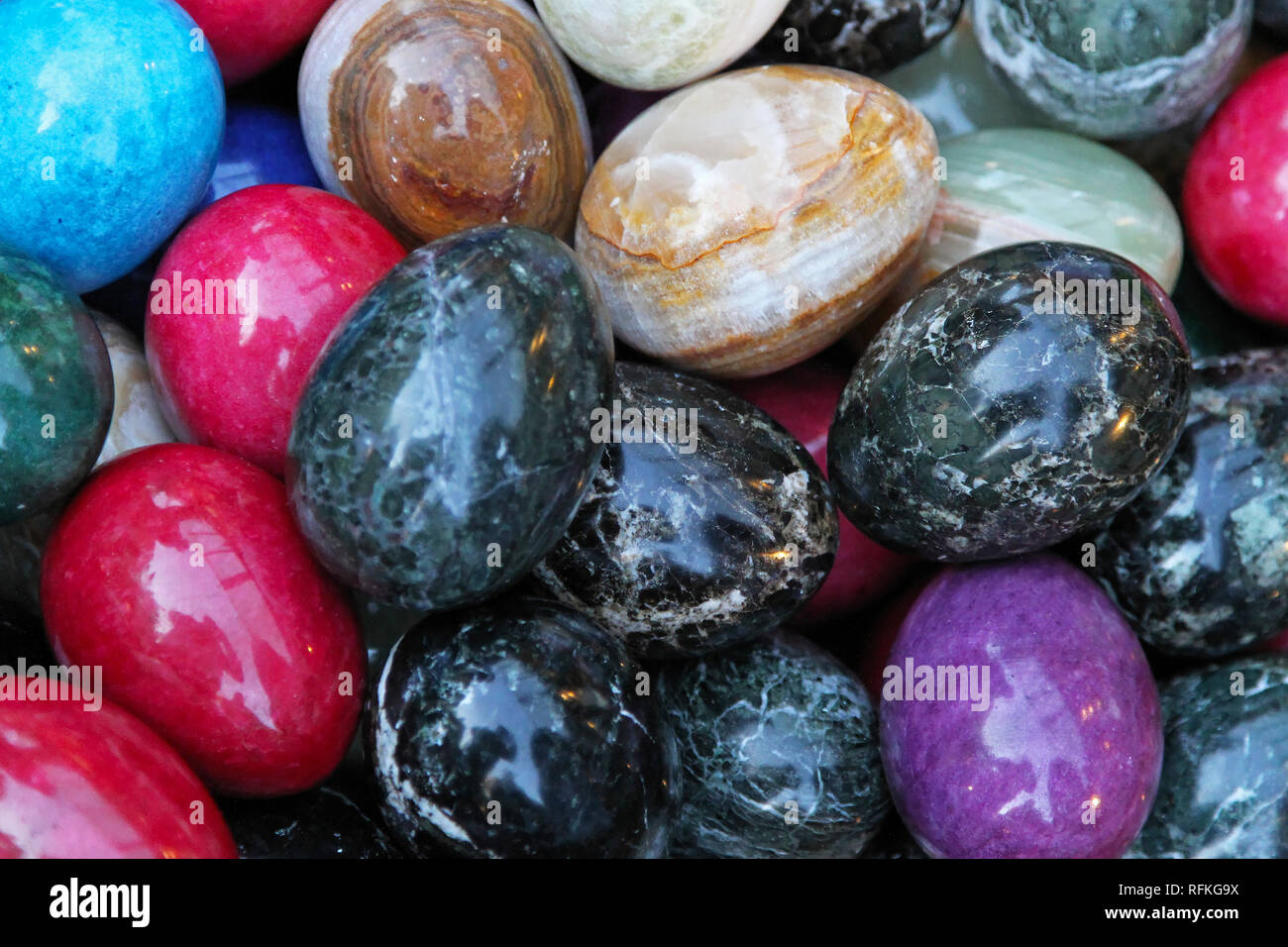 Big pile of colorful shiny marble eggs Stock Photo - Alamy