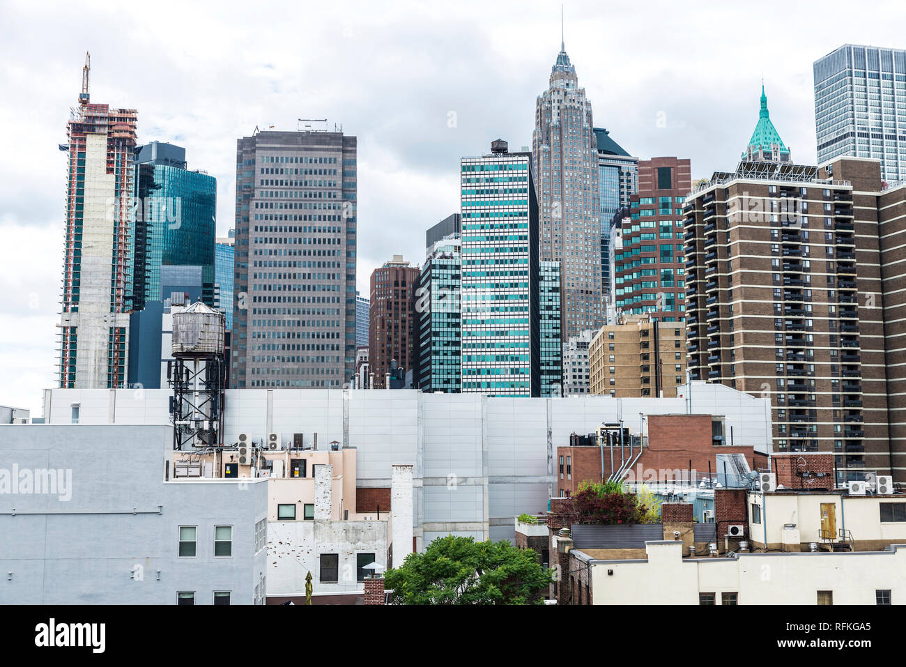 Modern skyscrapers, roof top of buildings and an old water tank in ...