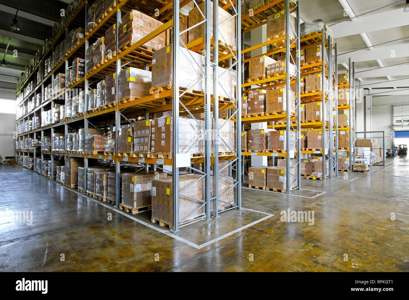 Shelves and racks in distribution warehouse interior Stock Photo - Alamy