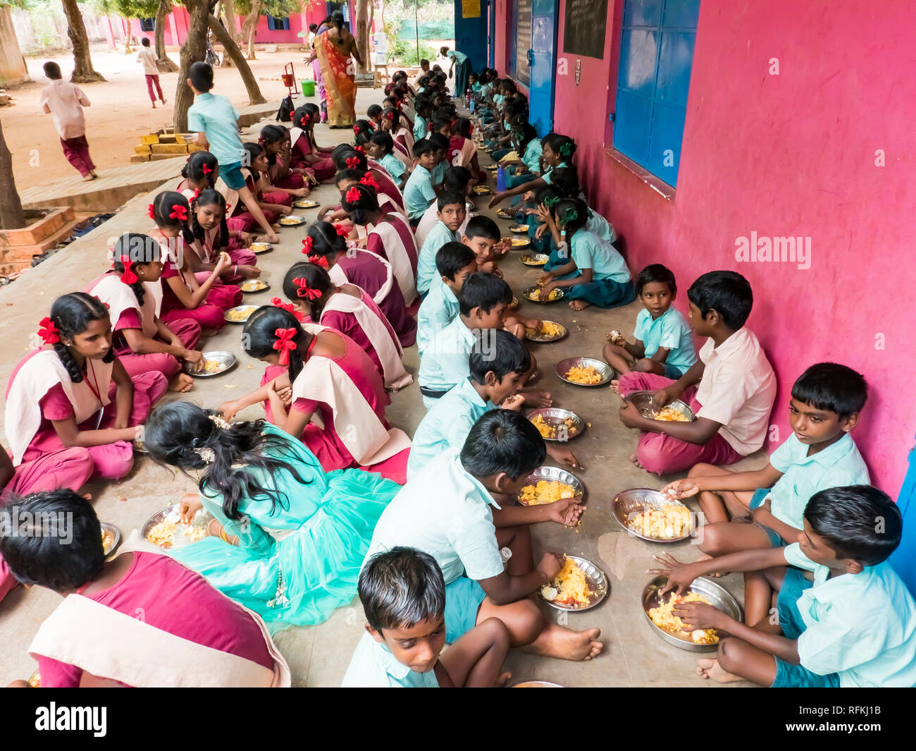 Boy school uniform sitting on floor hi-res stock photography and images ...