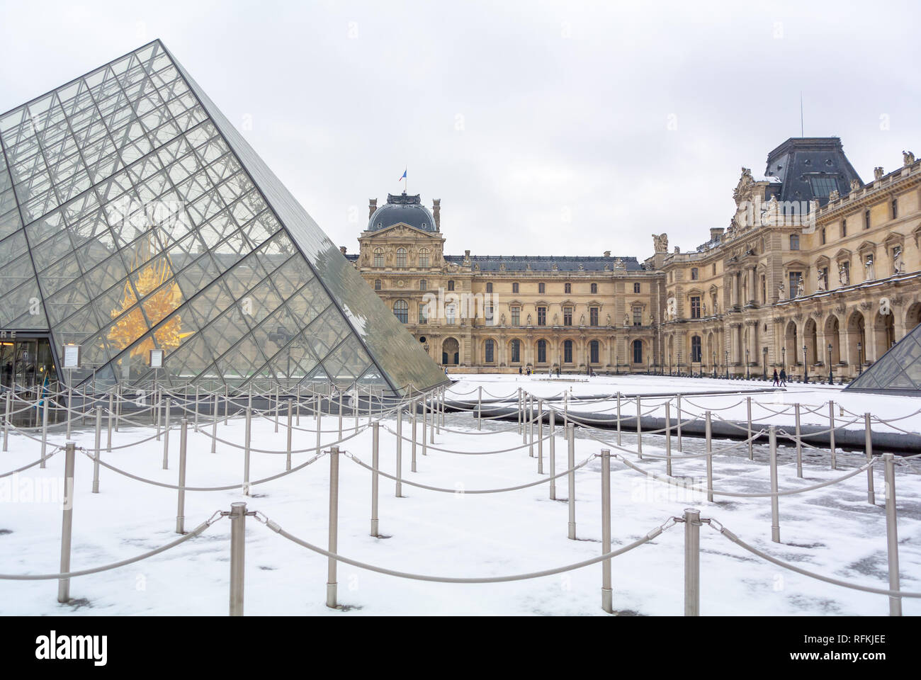 Pyramid and Louvre museum under snow, Paris, France Stock Photo - Alamy