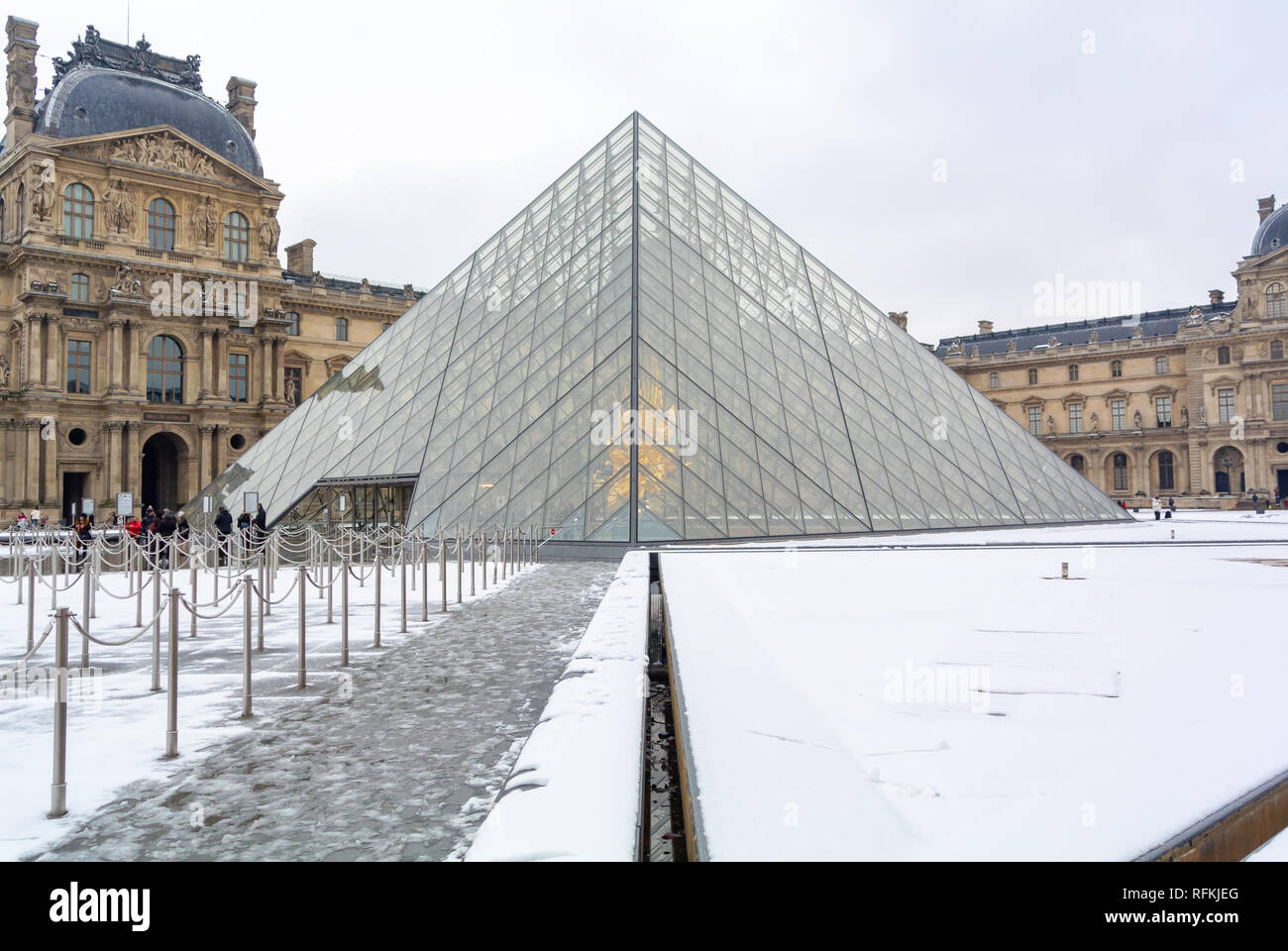 Pyramid and Louvre museum under snow, Paris, France Stock Photo - Alamy