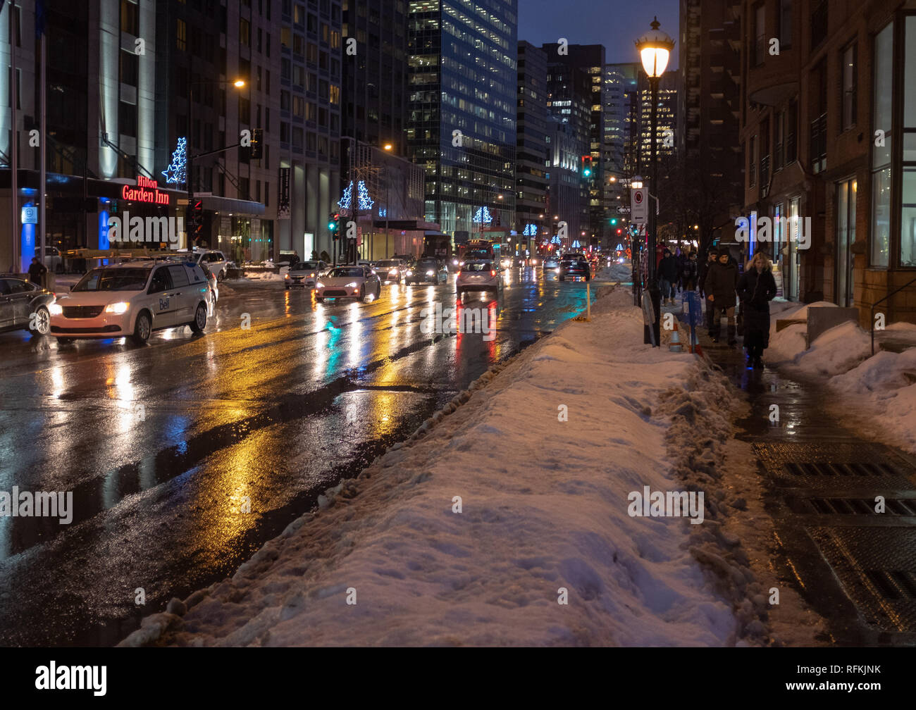Late night street shot with snow and cars Stock Photo - Alamy
