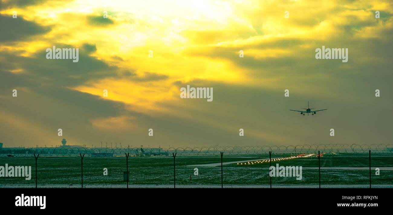 Airport landscape with landing aircraft at a beautiful sunset Stock ...